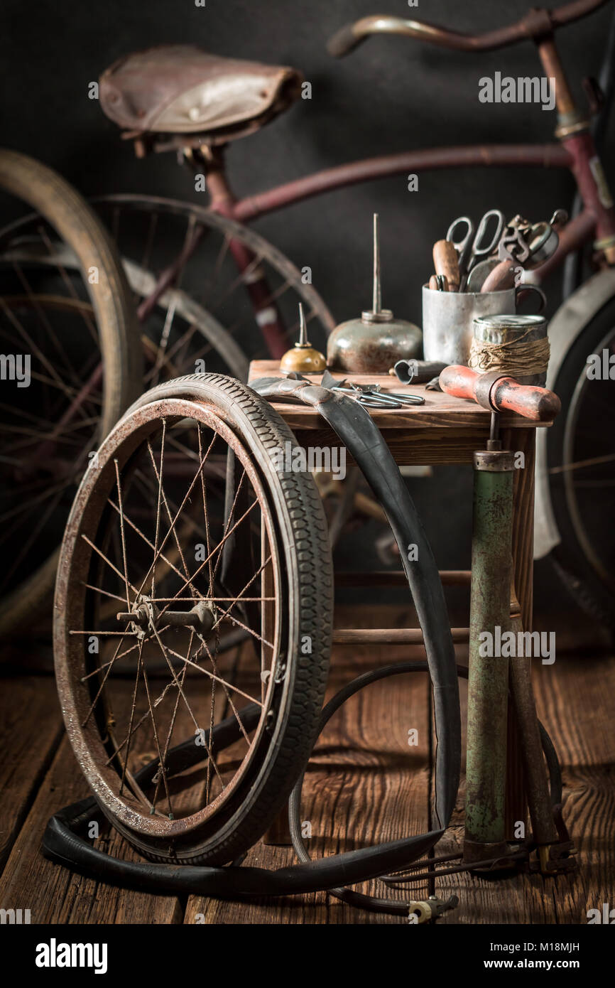 Old bike fix service with wheels, tools, and rubber patch Stock Photo ...