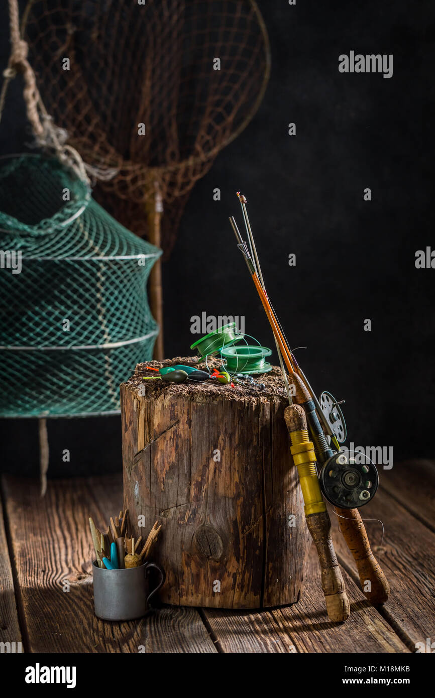 Retro angler equipment with fishing rod and lures Stock Photo - Alamy