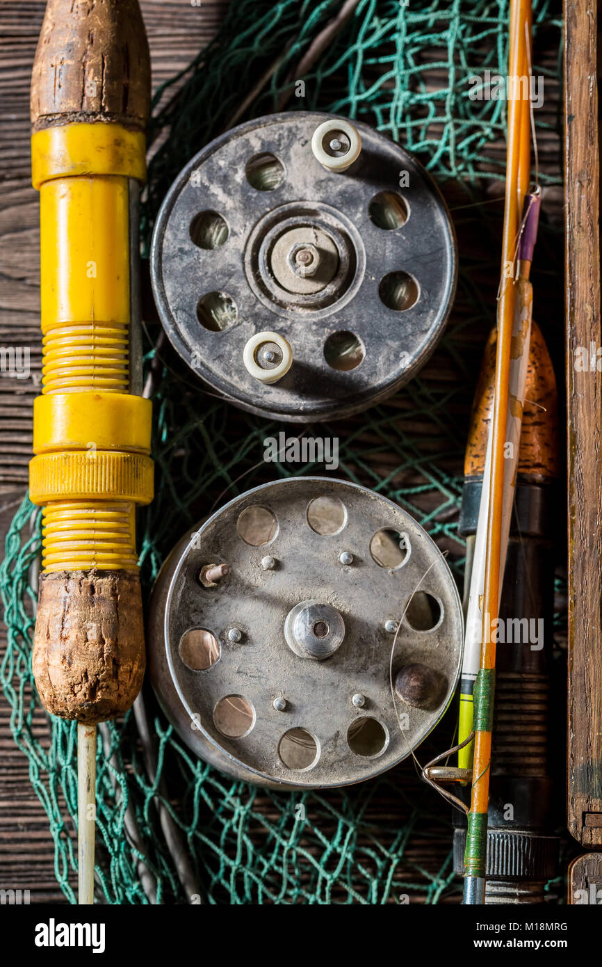 Old angler equipment with flies, floats and rods Stock Photo - Alamy