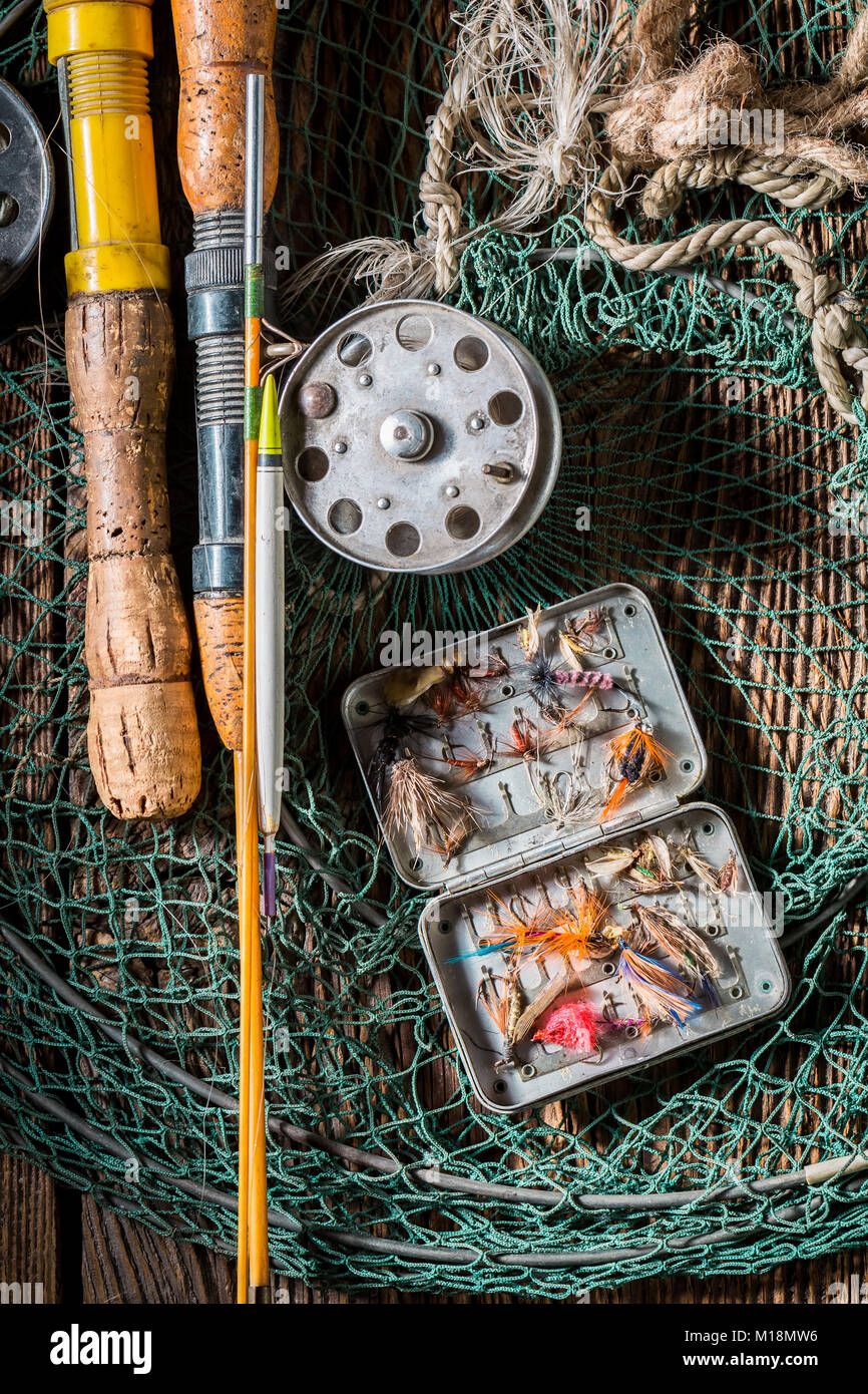 Vintage angler equipment with flies, floats and rods Stock Photo - Alamy