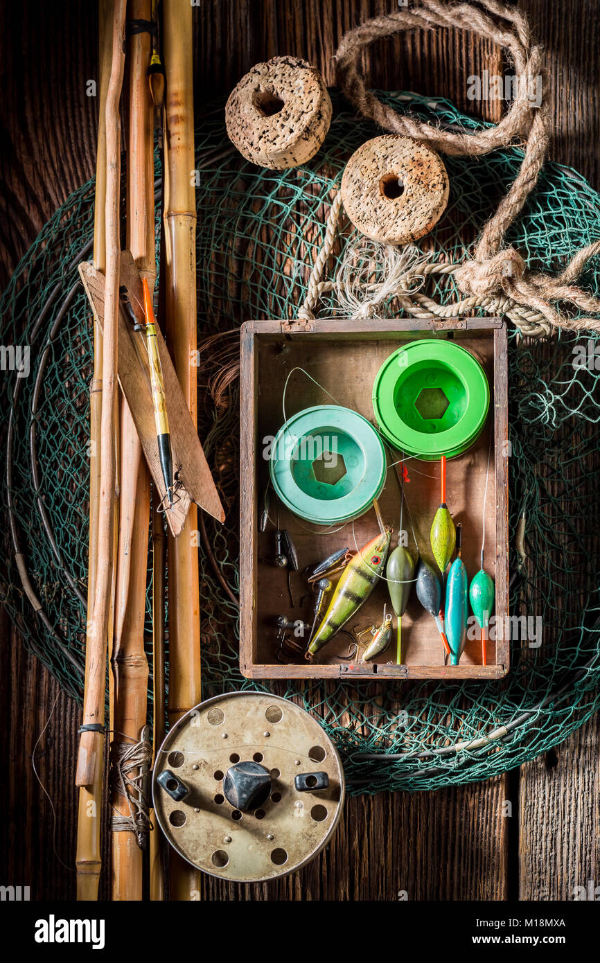 Retro angler equipment with fishing flies and rods Stock Photo - Alamy