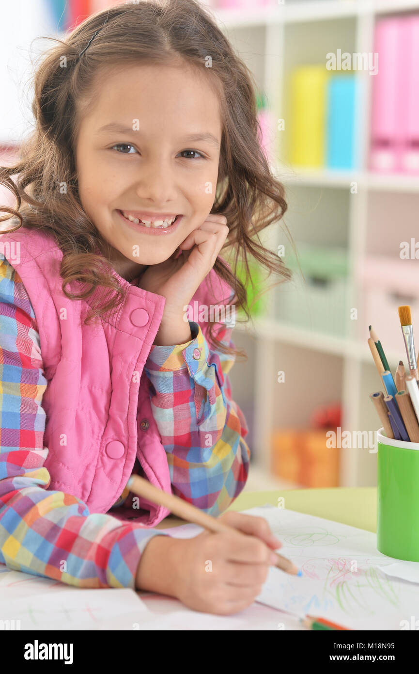 smiling girl drawing at home Stock Photo - Alamy