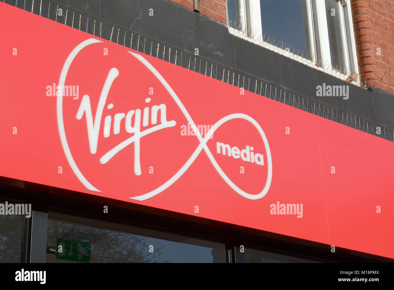 Sign outside virgin media shop in uk high street hi-res stock ...