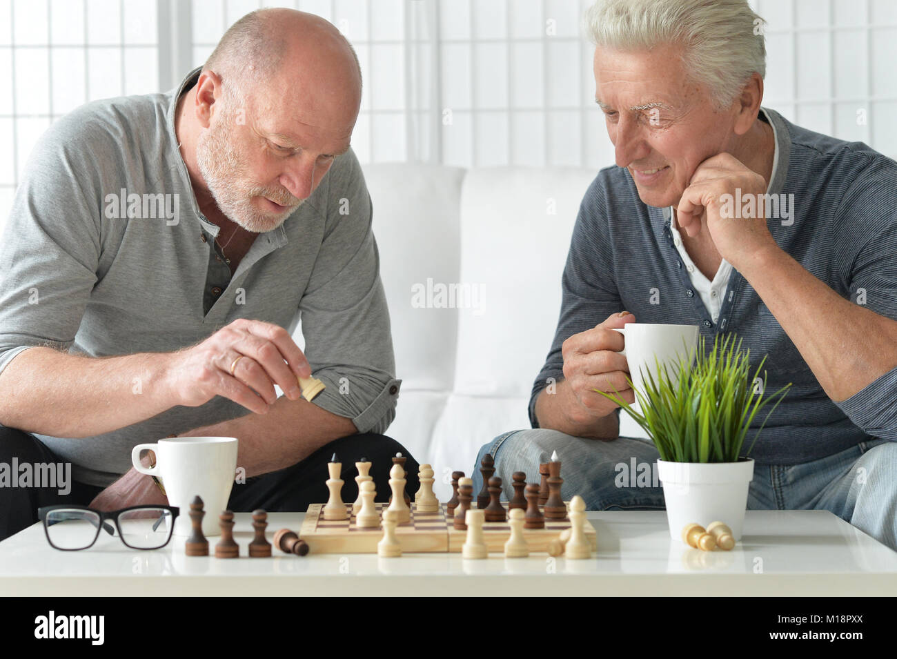 senior men playing chess Stock Photo - Alamy