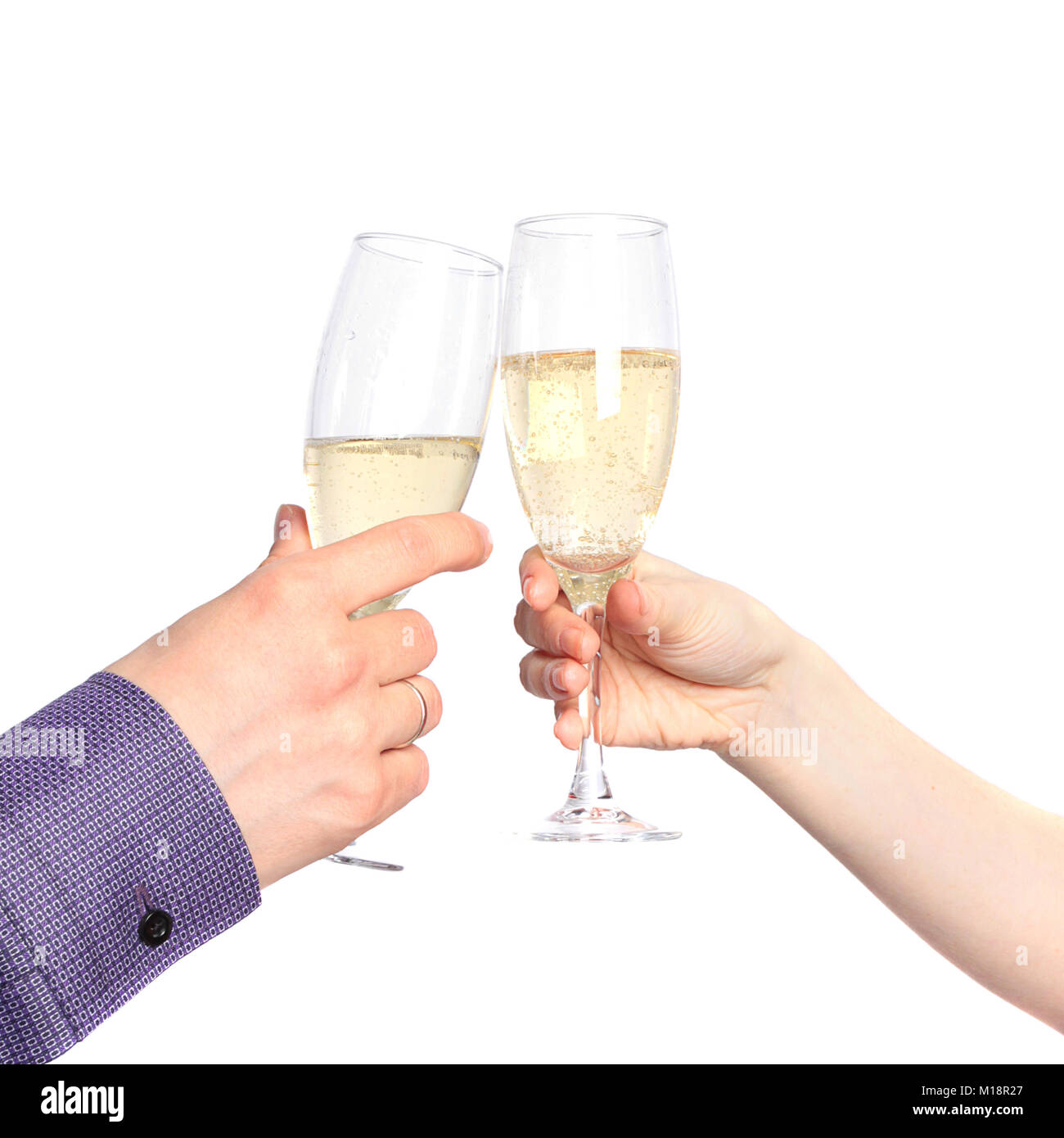 Champagne toast. Two hands with glasses of champagne isolated on a ...
