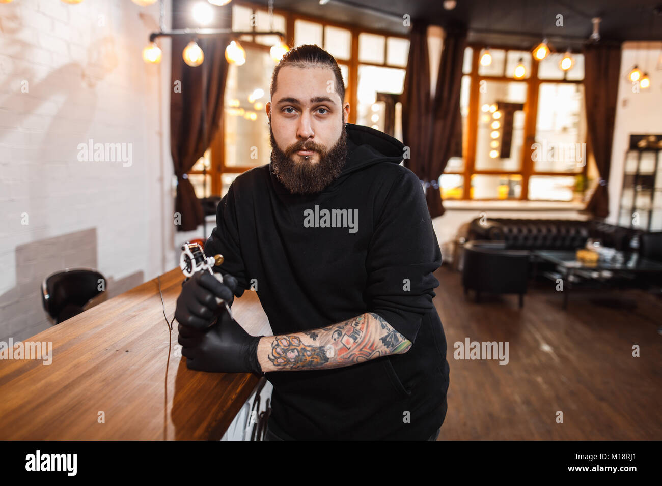 Portrait of professional creative tattoo master Stock Photo - Alamy