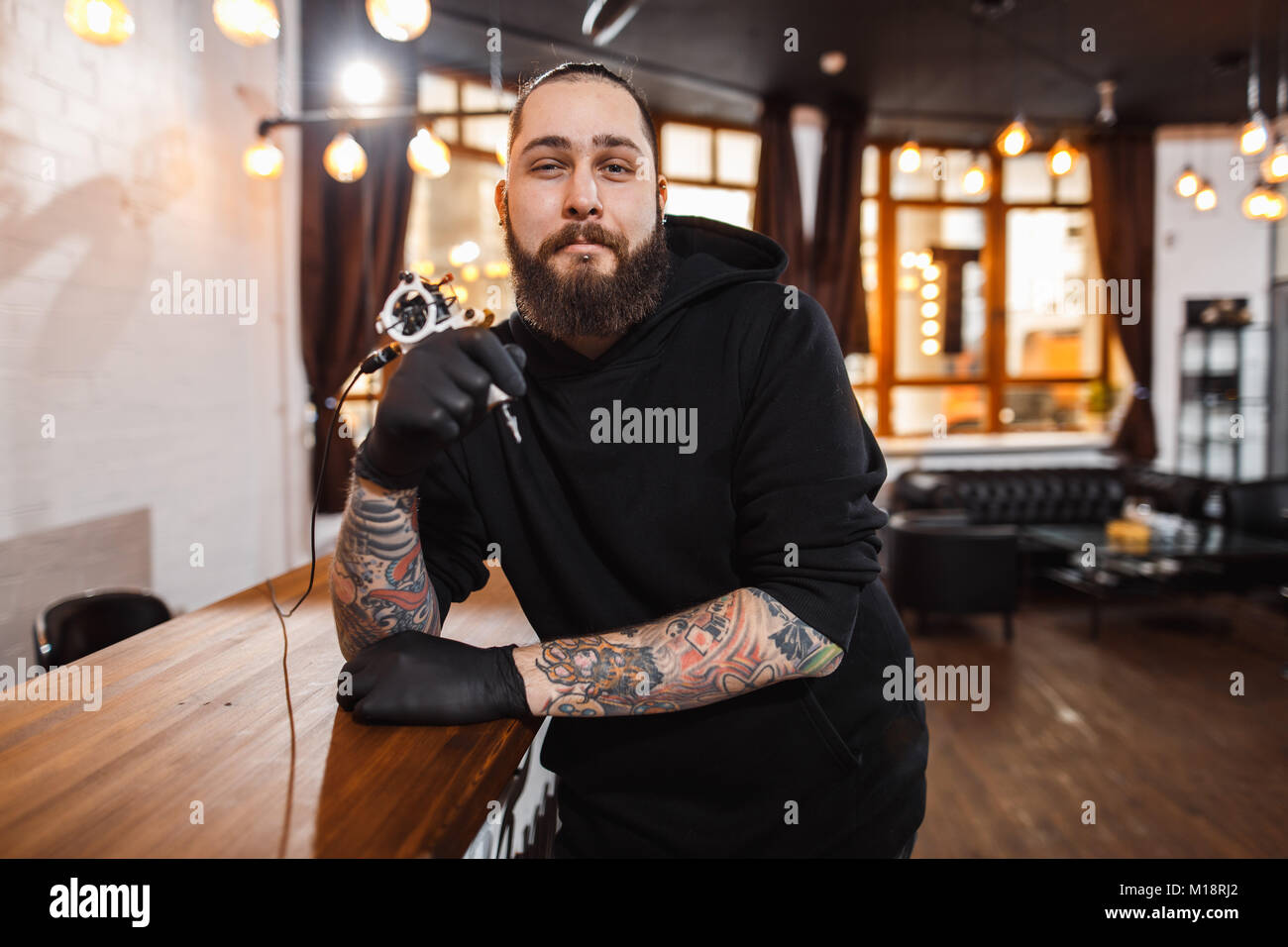 Portrait of professional creative tattoo master Stock Photo - Alamy