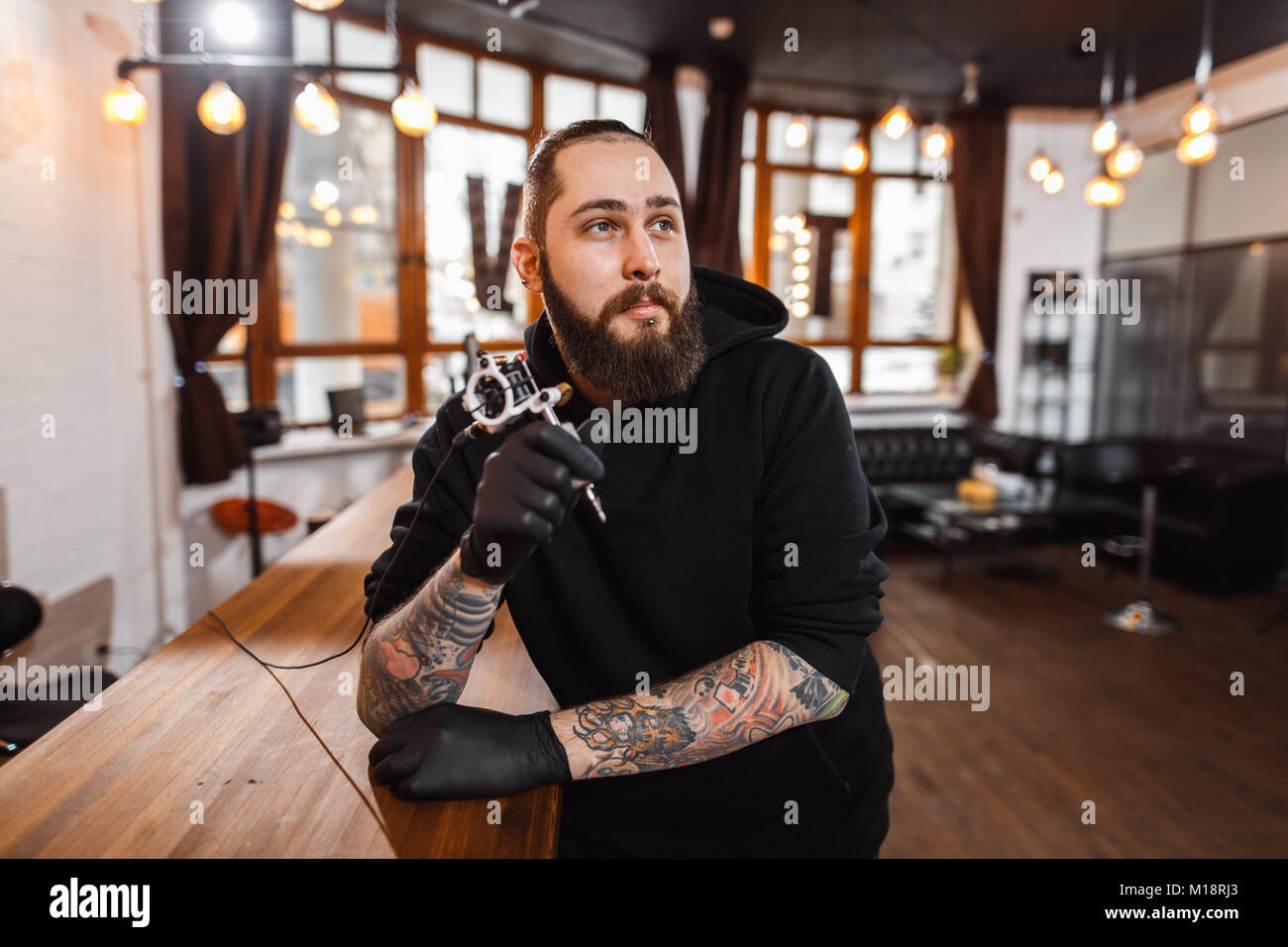 Portrait of professional creative tattoo master Stock Photo - Alamy