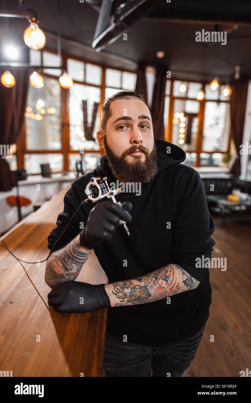 Portrait of professional creative tattoo master Stock Photo - Alamy