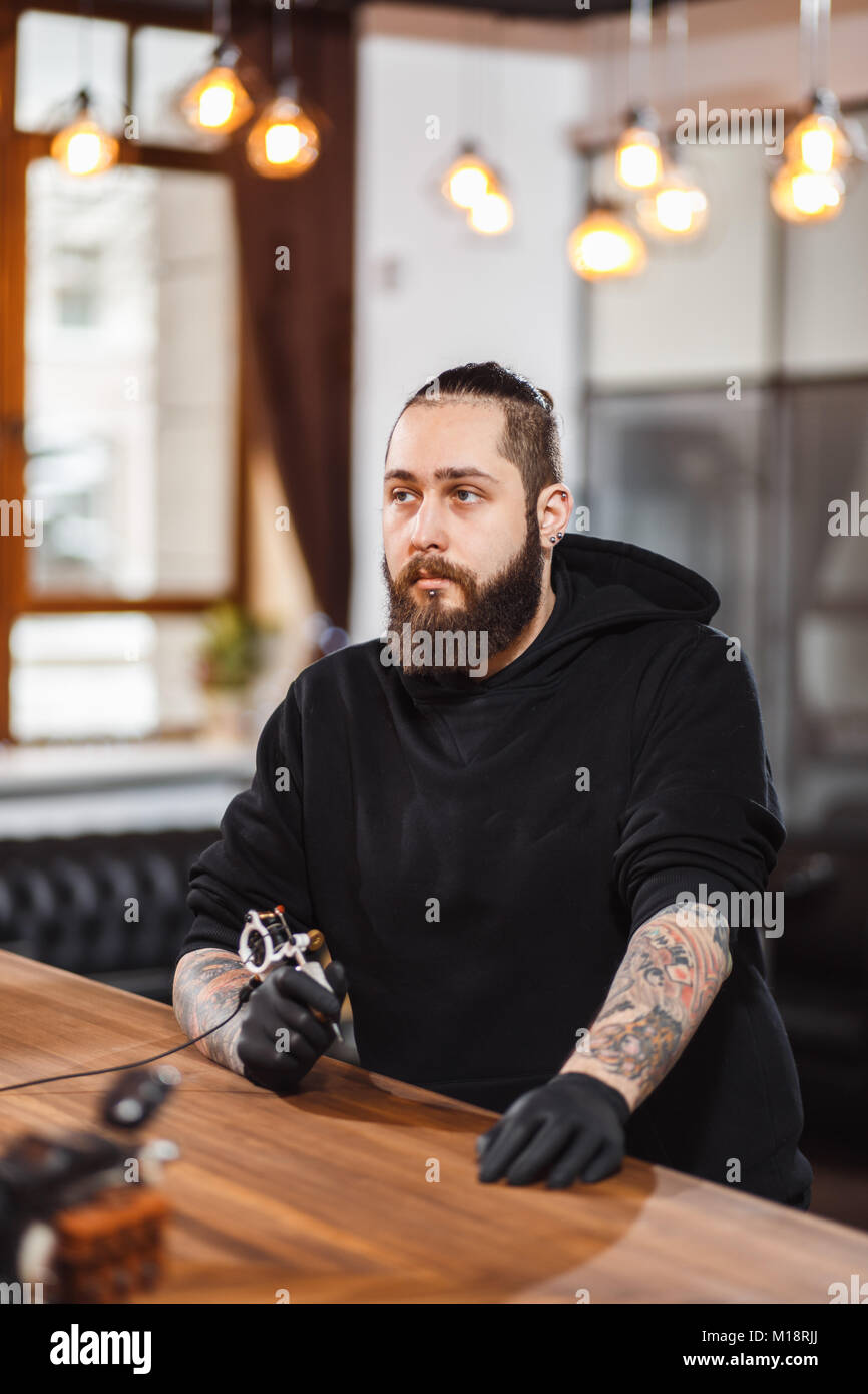 Portrait of professional creative tattoo master Stock Photo - Alamy