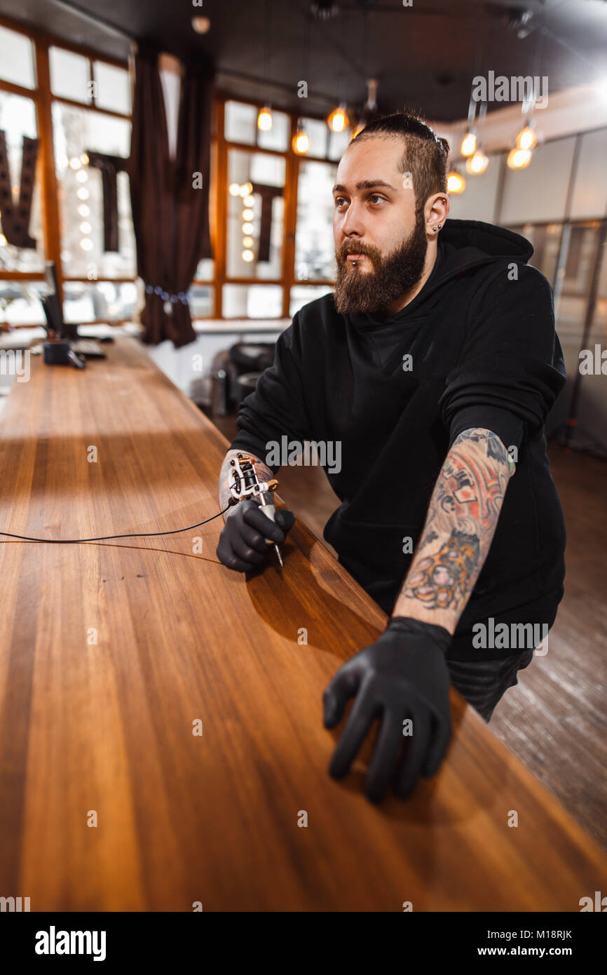 Portrait of professional creative tattoo master Stock Photo - Alamy