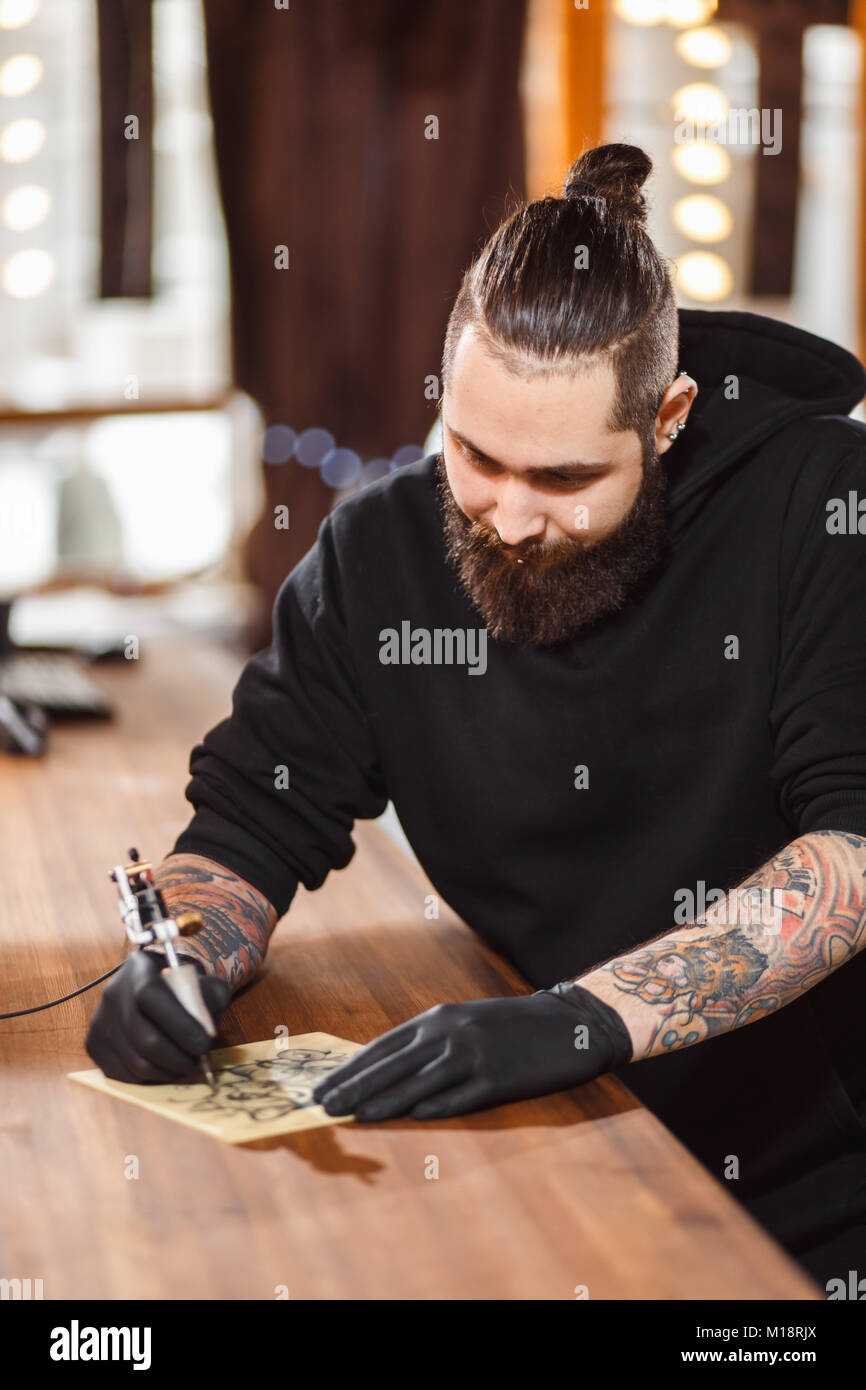 Portrait of professional creative tattoo master Stock Photo - Alamy