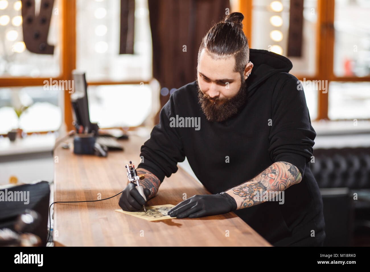 Portrait of professional creative tattoo master Stock Photo - Alamy