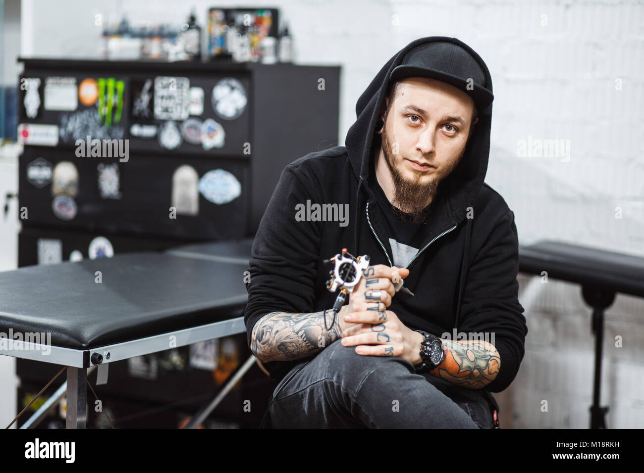 Portrait of professional creative tattoo master Stock Photo - Alamy