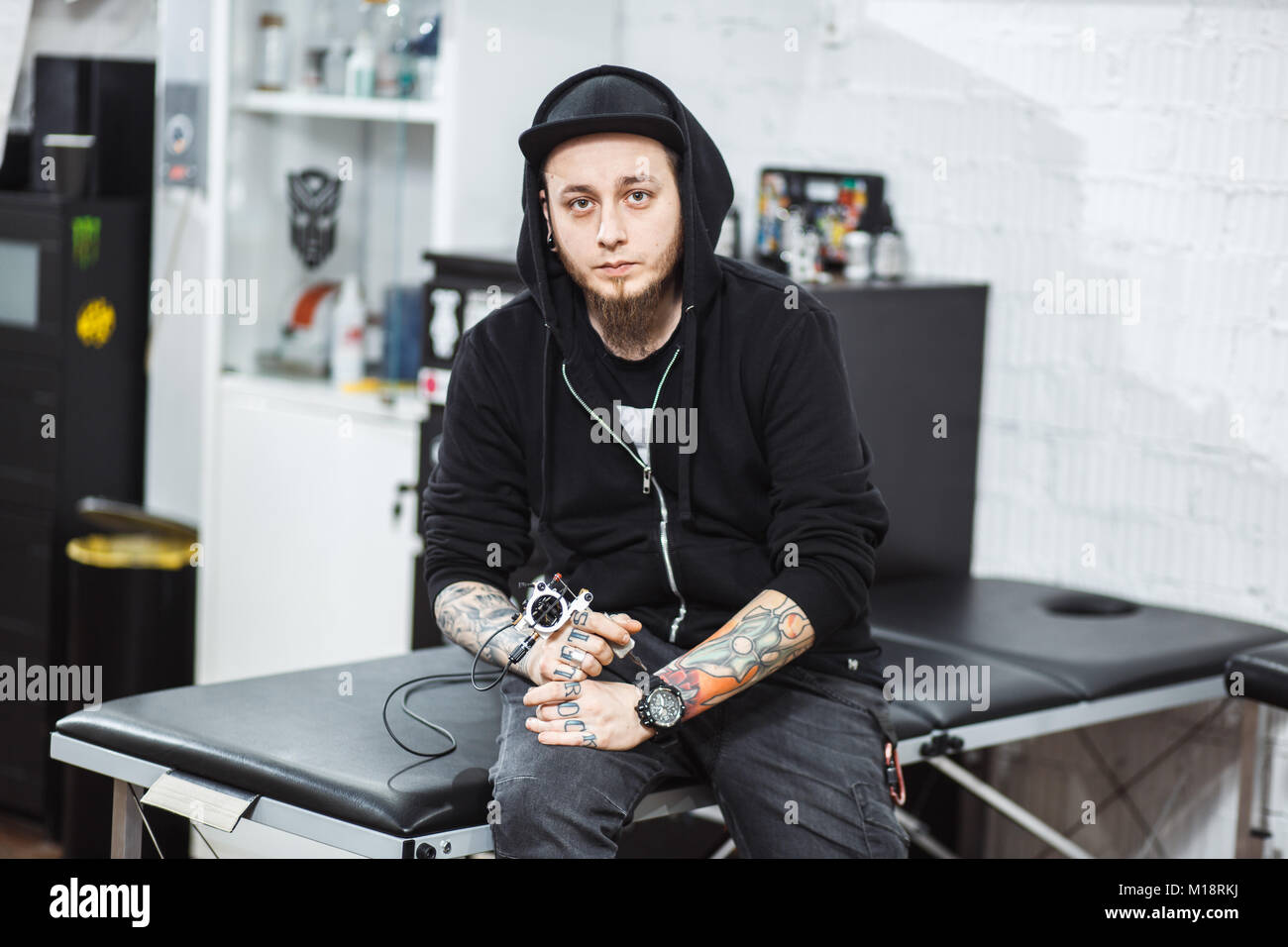 Portrait of professional creative tattoo master Stock Photo - Alamy