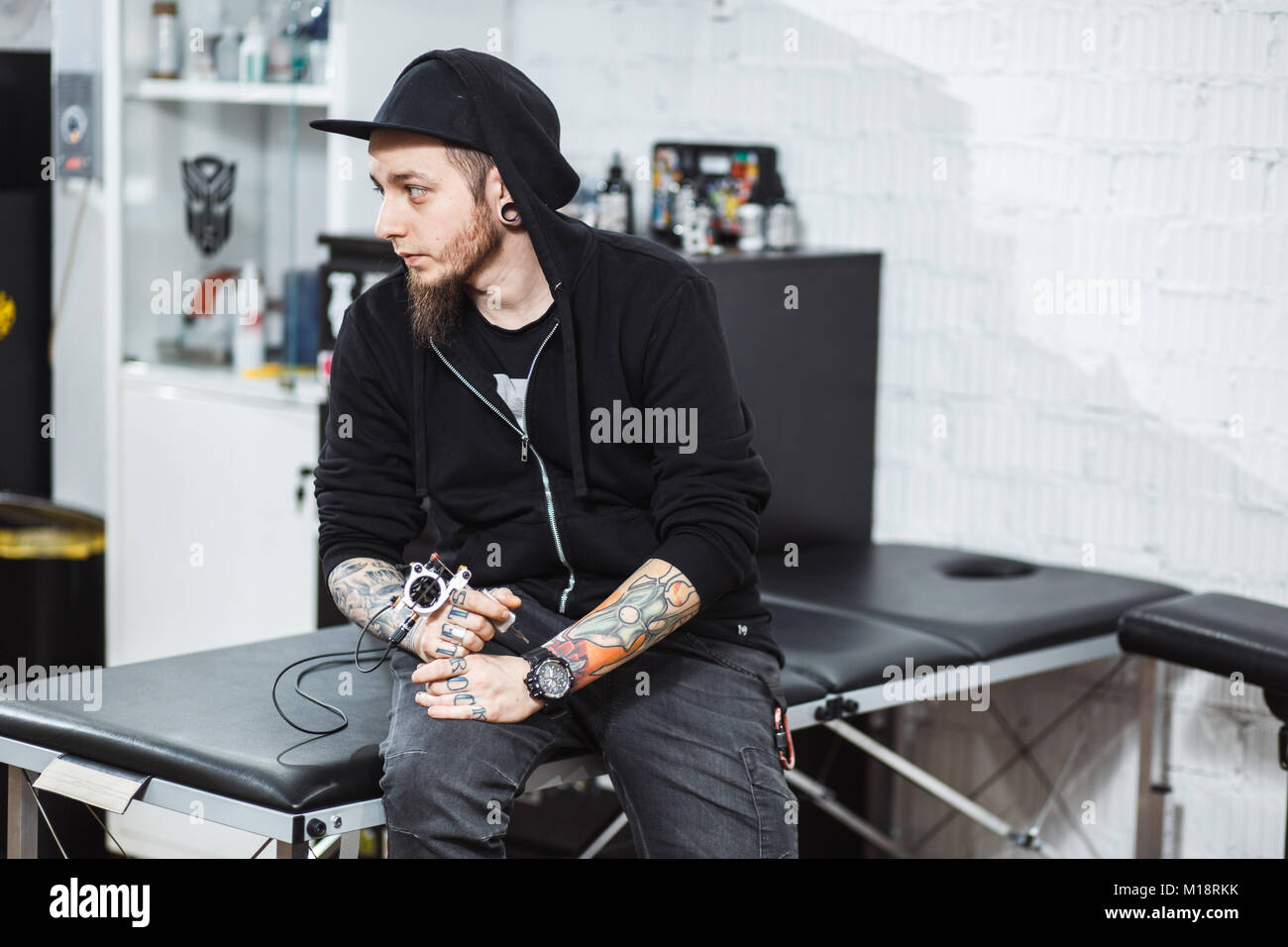Portrait of professional creative tattoo master Stock Photo - Alamy