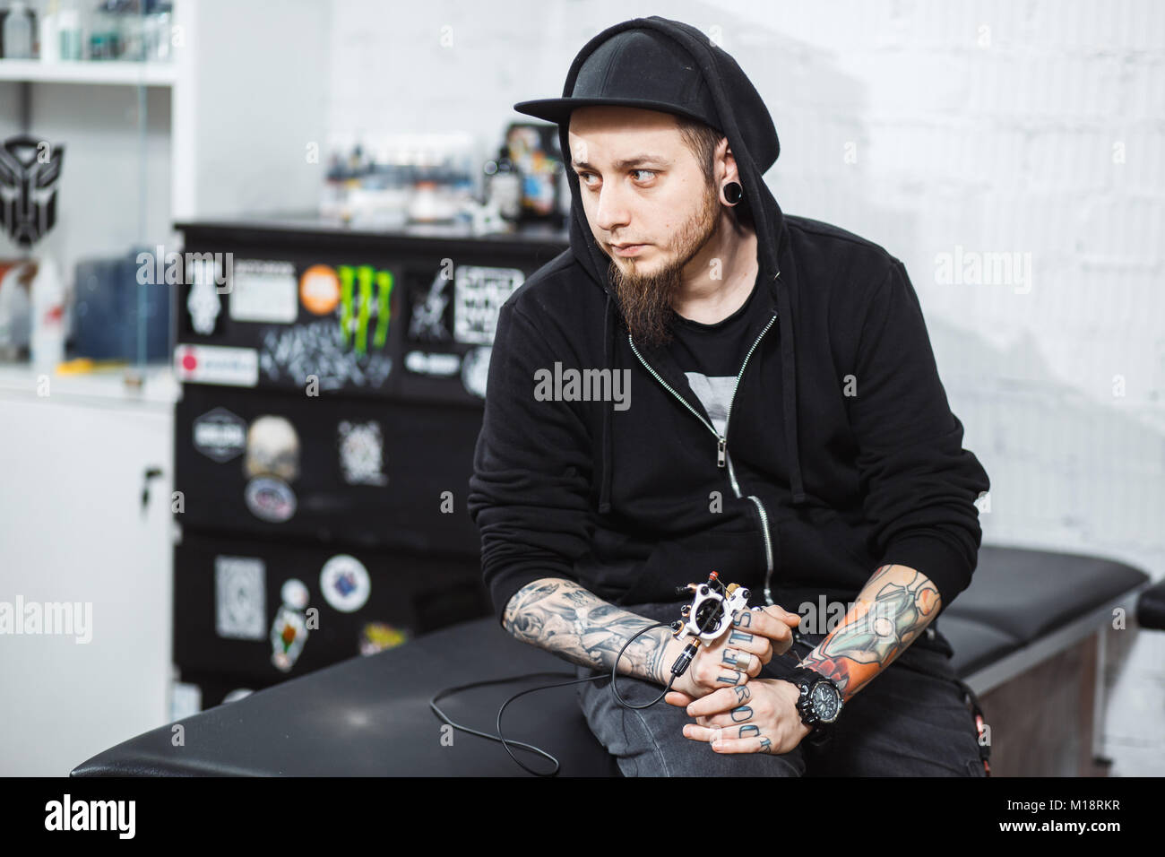Portrait of professional creative tattoo master Stock Photo - Alamy