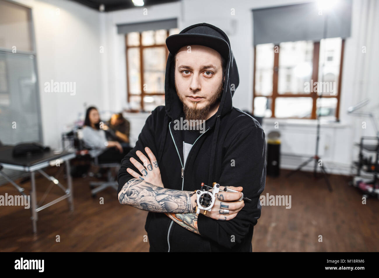 Portrait of professional creative tattoo master Stock Photo - Alamy