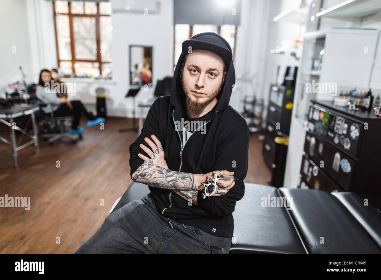 Portrait of professional creative tattoo master Stock Photo - Alamy