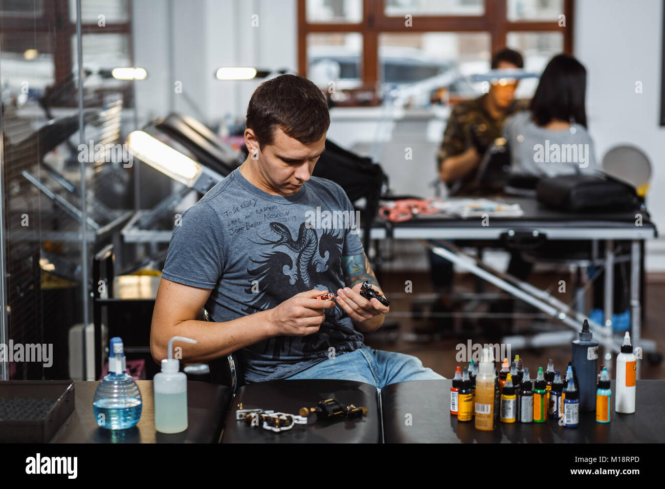 Portrait of professional creative tattoo master Stock Photo - Alamy