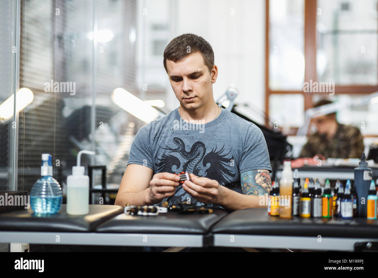 Portrait of professional creative tattoo master Stock Photo - Alamy