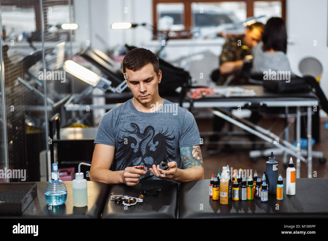Portrait of professional creative tattoo master Stock Photo - Alamy