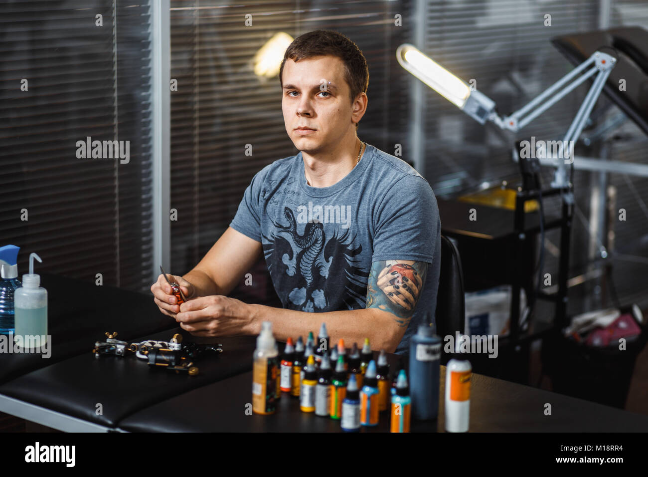 Portrait of professional creative tattoo master Stock Photo - Alamy
