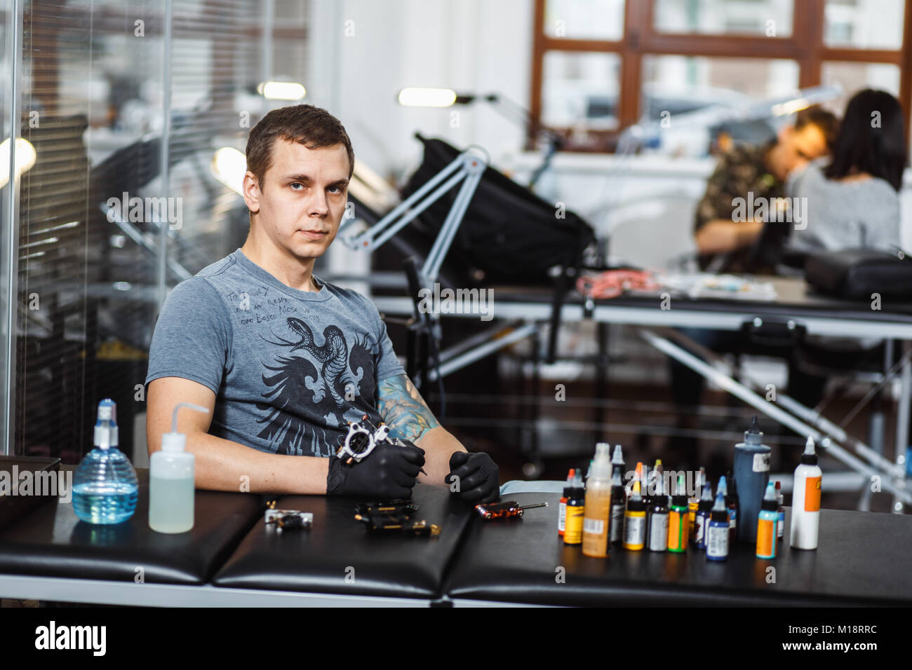 Portrait of professional creative tattoo master Stock Photo - Alamy