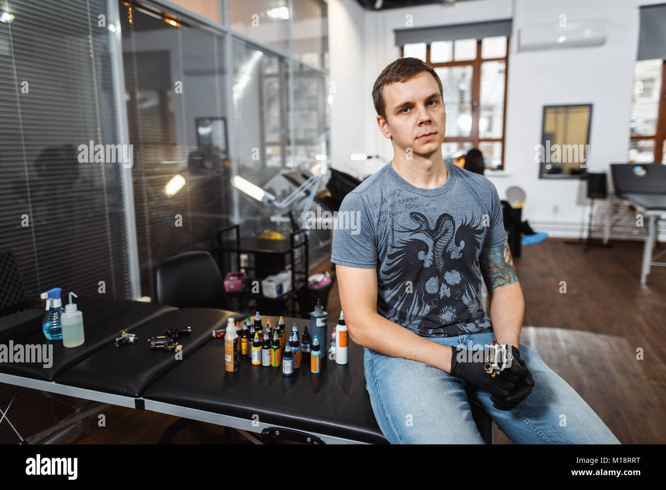 Portrait of professional creative tattoo master Stock Photo - Alamy