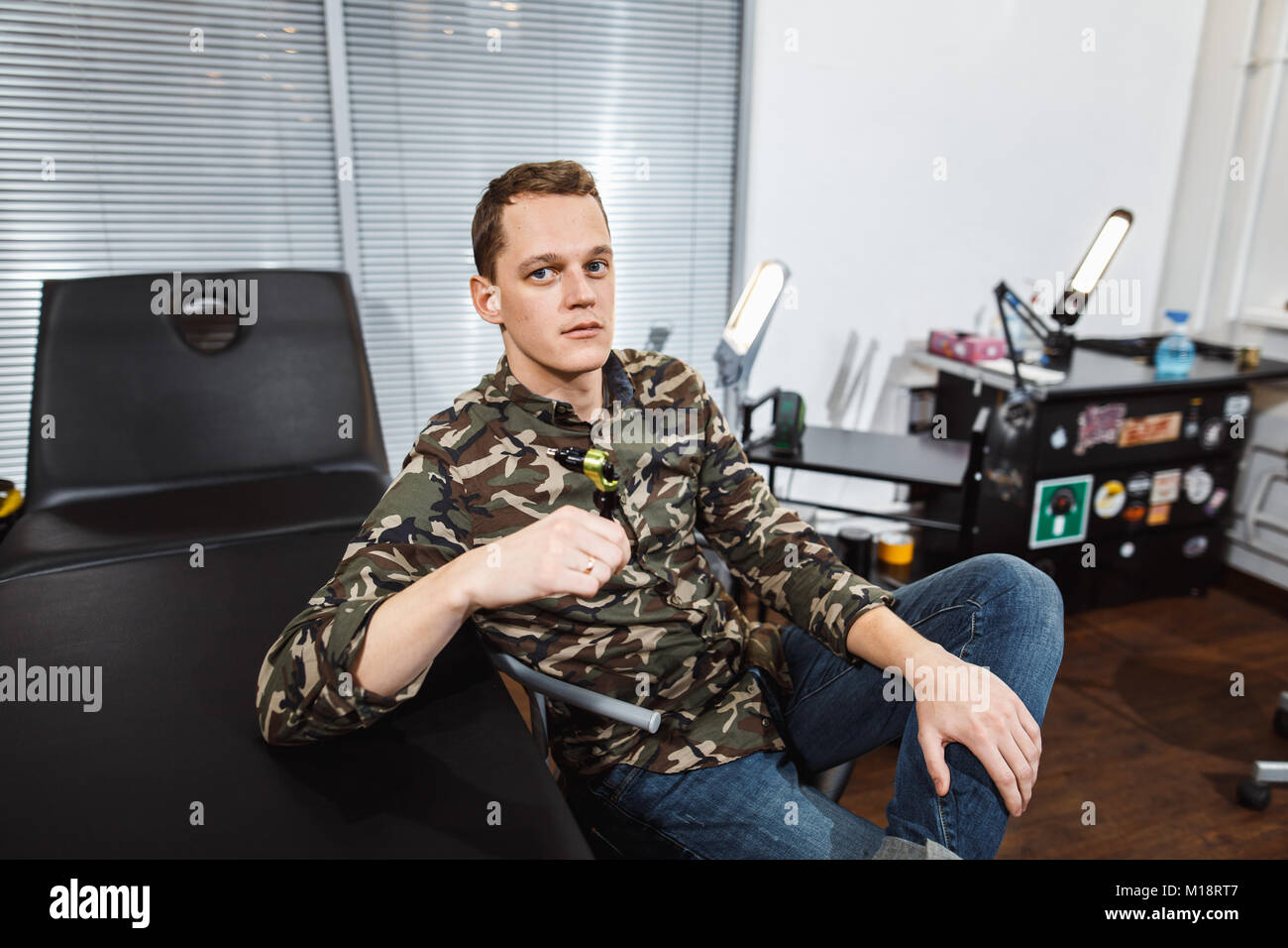 Portrait of professional creative tattoo master Stock Photo - Alamy