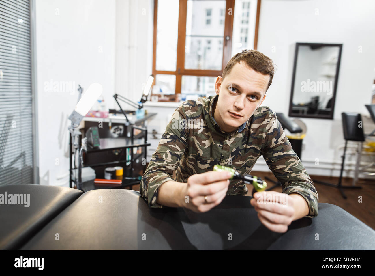 Portrait of professional creative tattoo master Stock Photo - Alamy