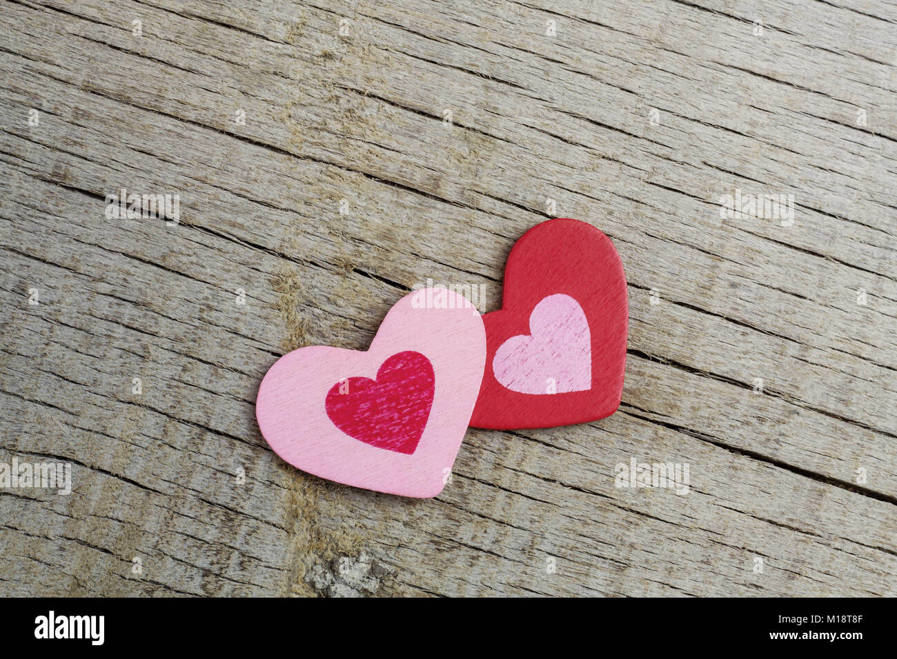 Two heart on wood with background Stock Photo - Alamy