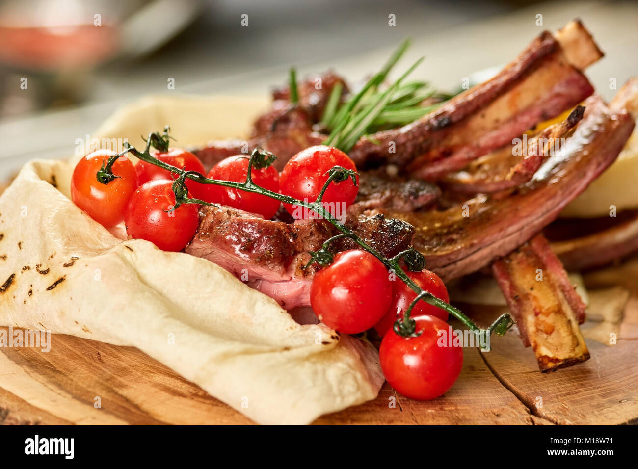 Grilled meat and tomatoes in lavash Stock Photo - Alamy