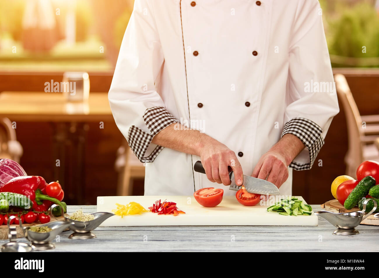Cooker dicing tomato Stock Photo - Alamy