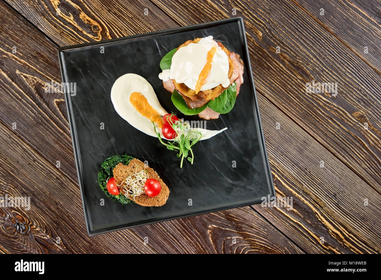 Black rectangle plate with food, top view Stock Photo - Alamy
