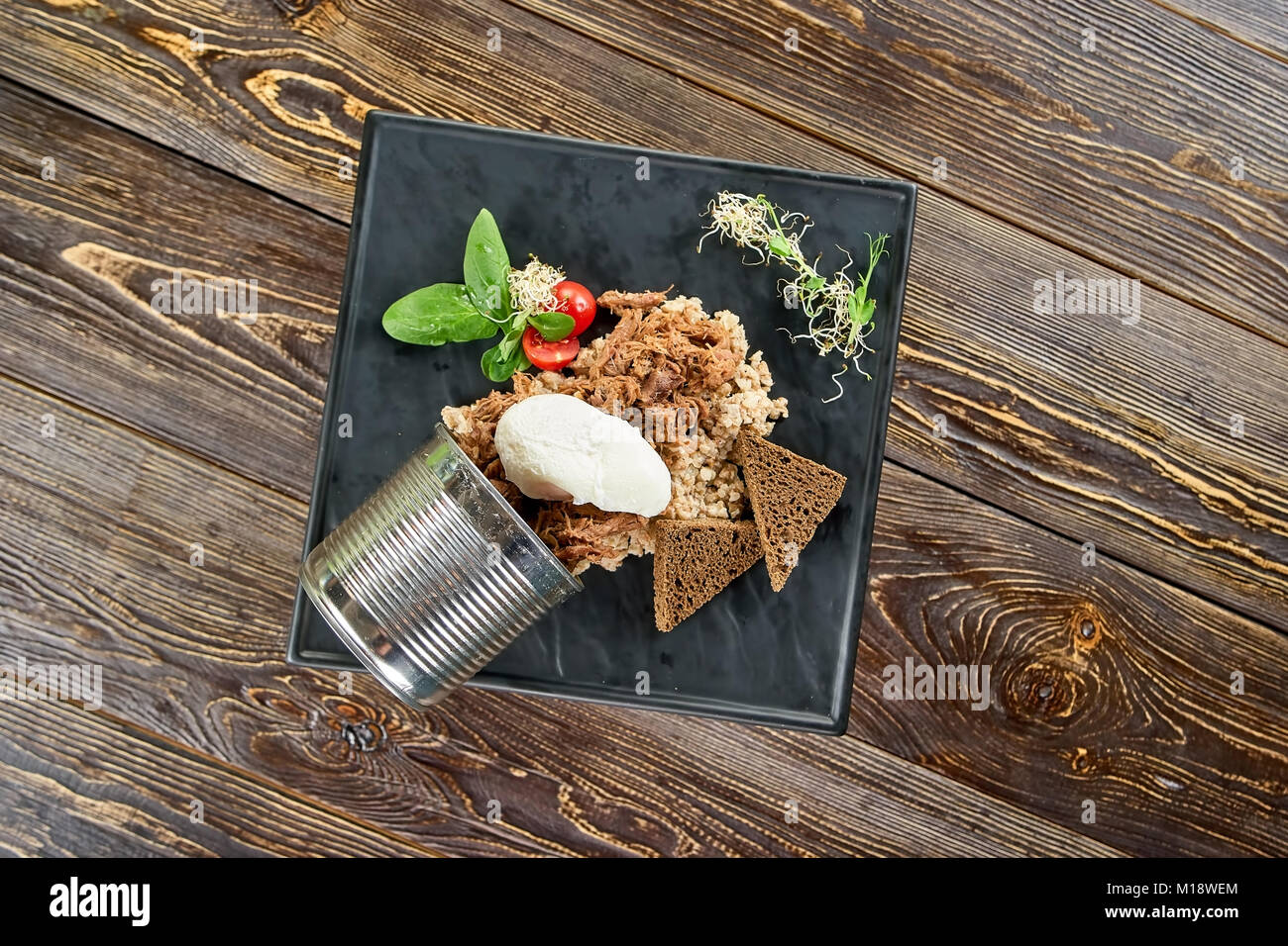 Food falling out of can Stock Photo - Alamy