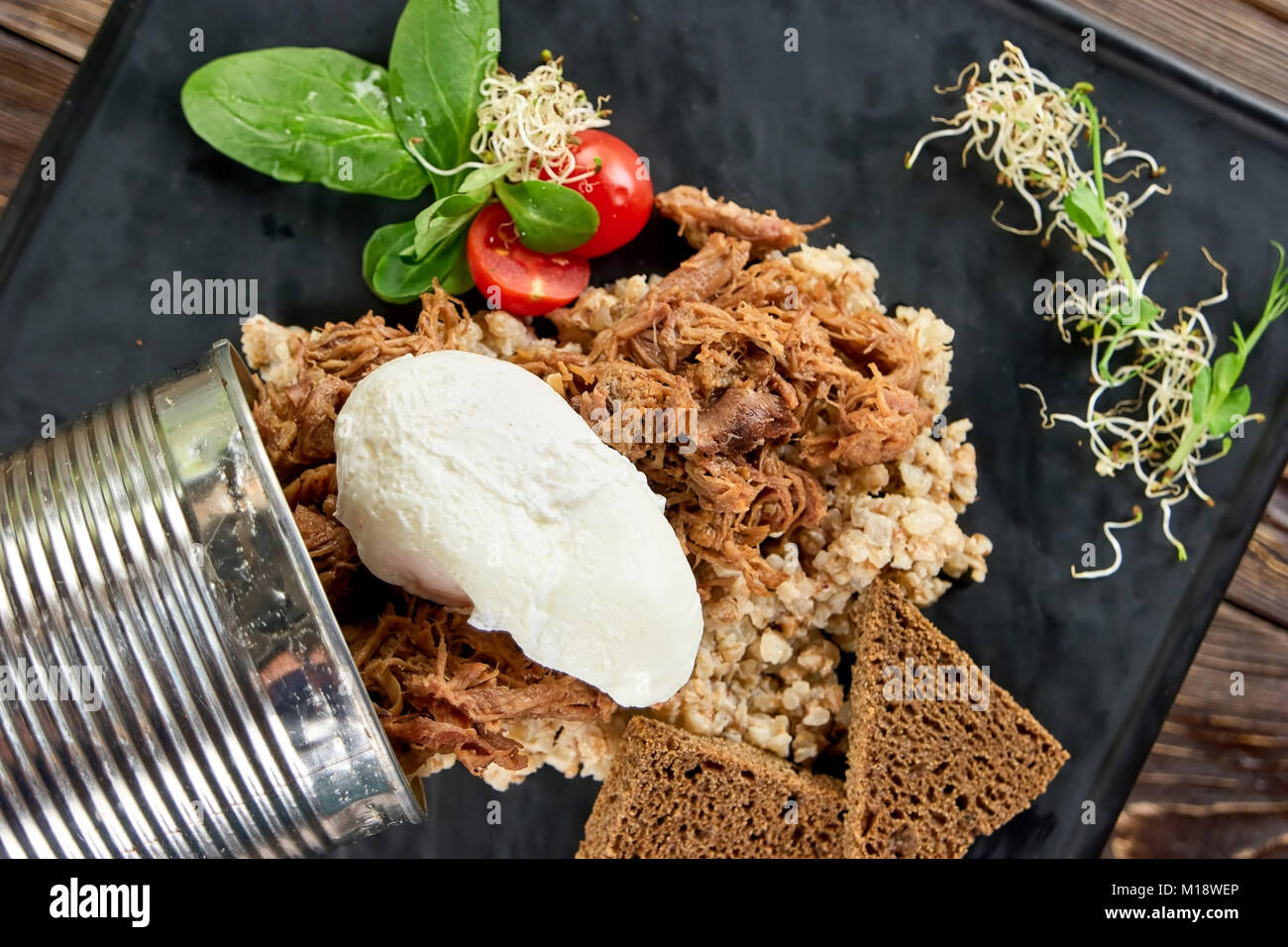 Can and dropping food out of it, closeup Stock Photo - Alamy