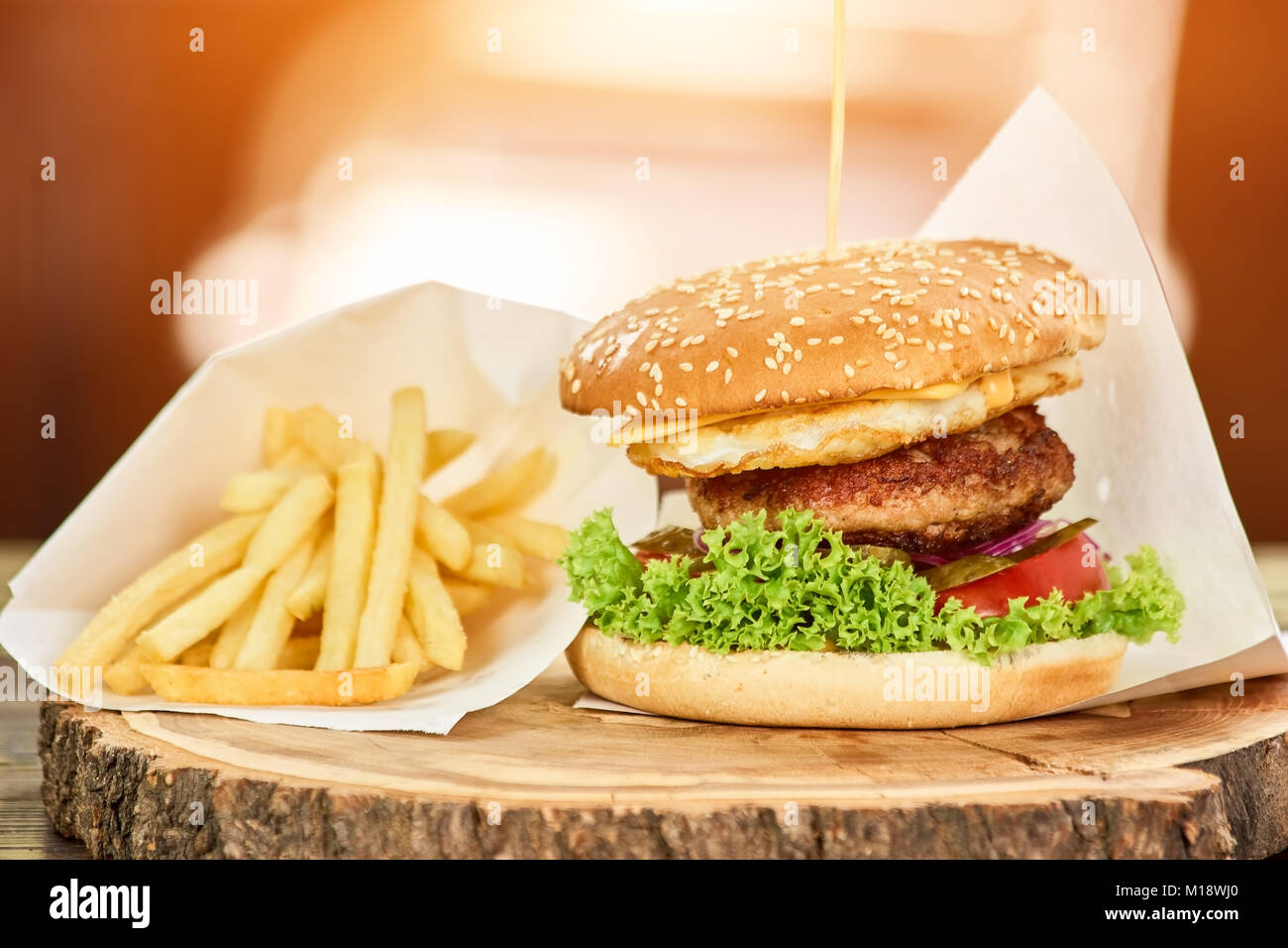 Junk food set on wooden plate Stock Photo - Alamy