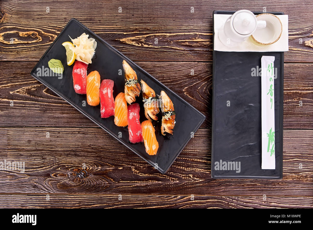 Juicy wet nigiri sushi and side dish, top view Stock Photo - Alamy