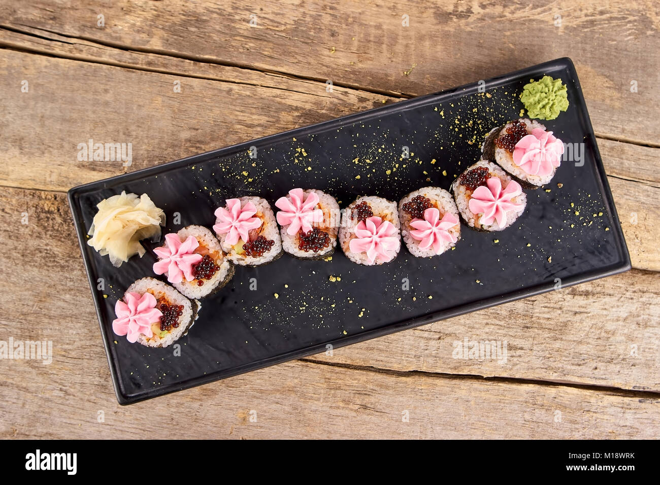 Served sushi rolls with garnish, top view Stock Photo - Alamy