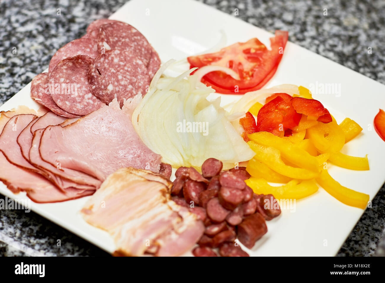Sliced cold meats and vegetables on white plate Stock Photo - Alamy
