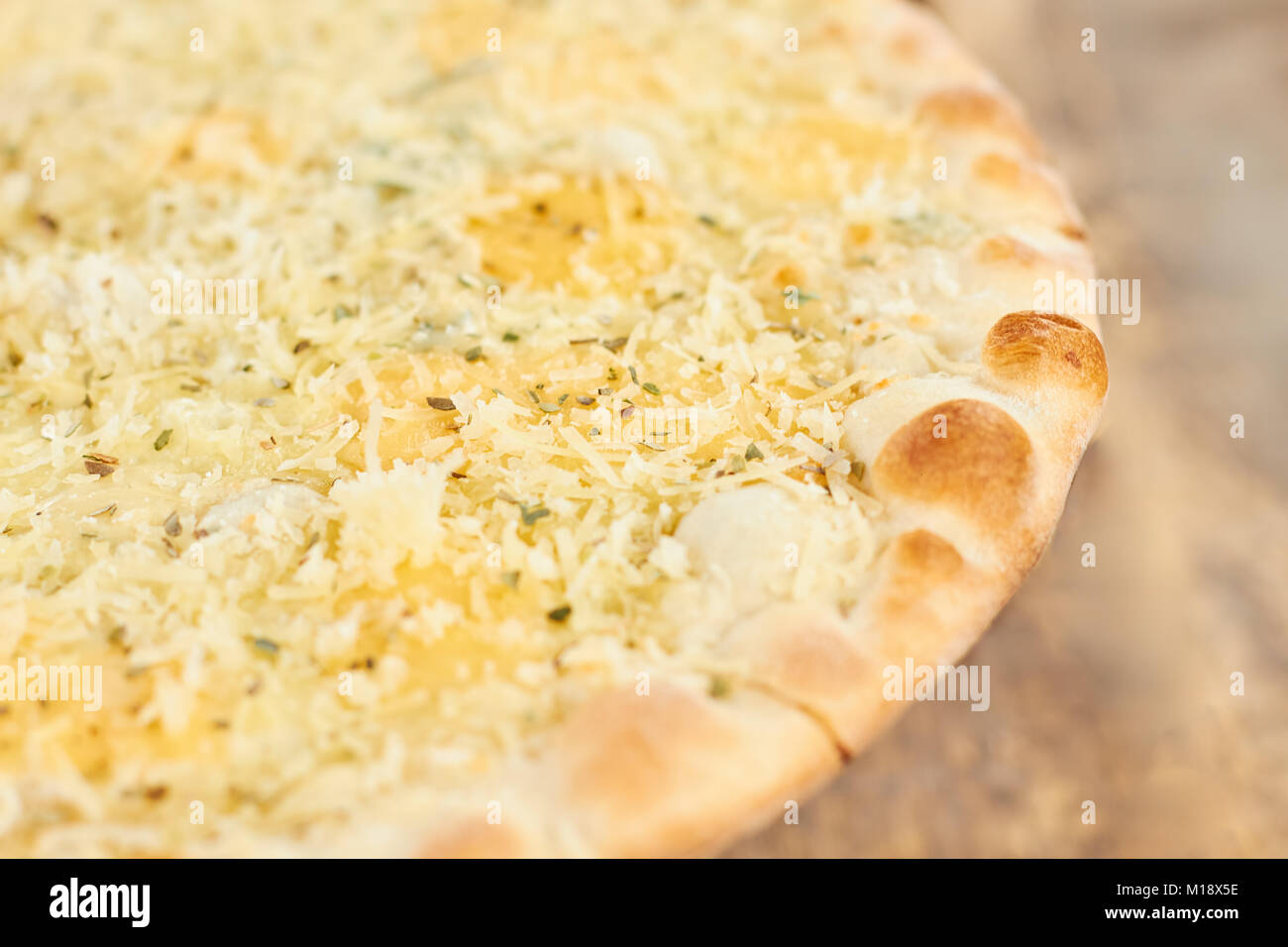 Cheese pizza crust close up Stock Photo - Alamy