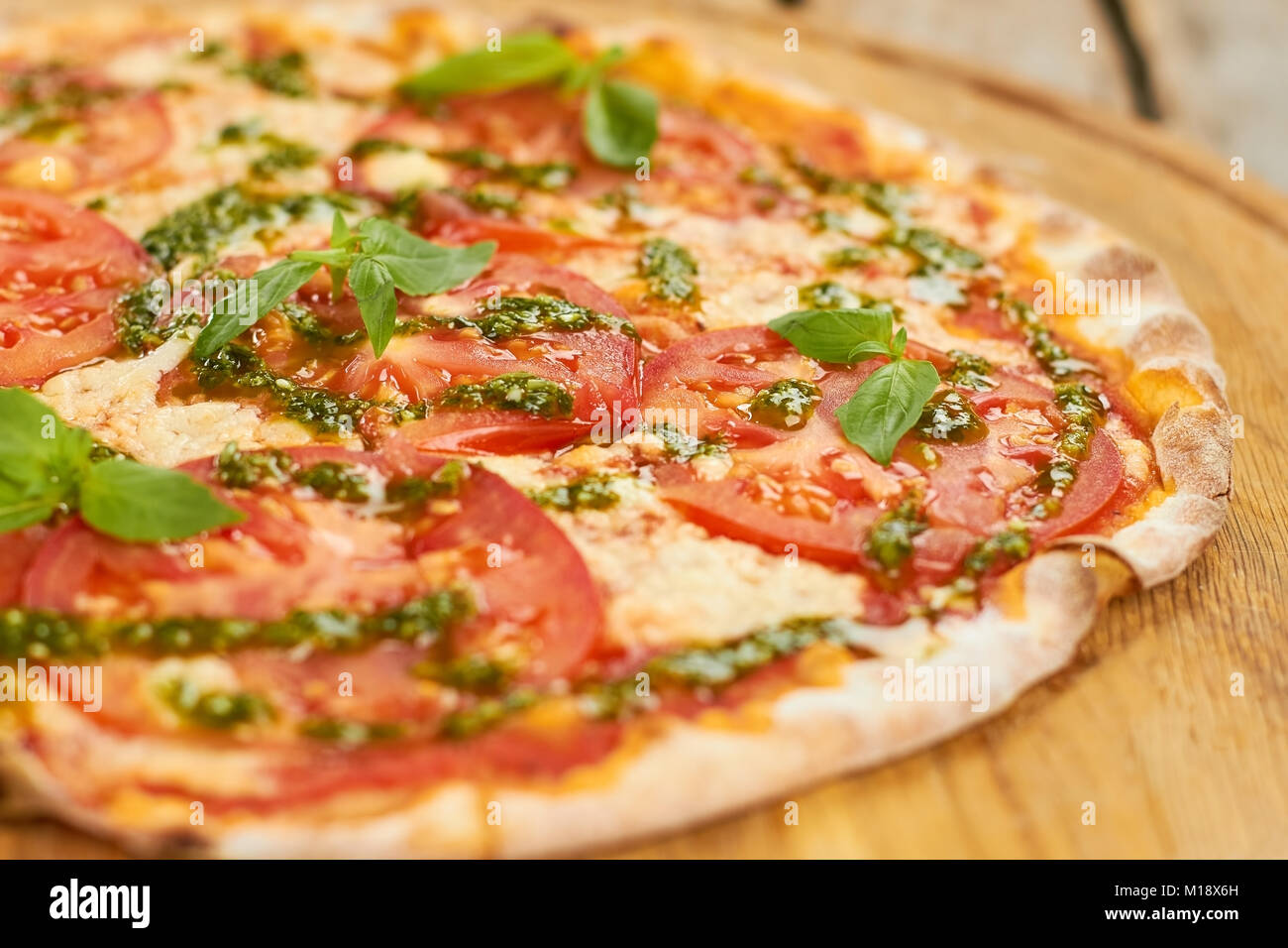 Close up tomato pizza with basil Stock Photo - Alamy