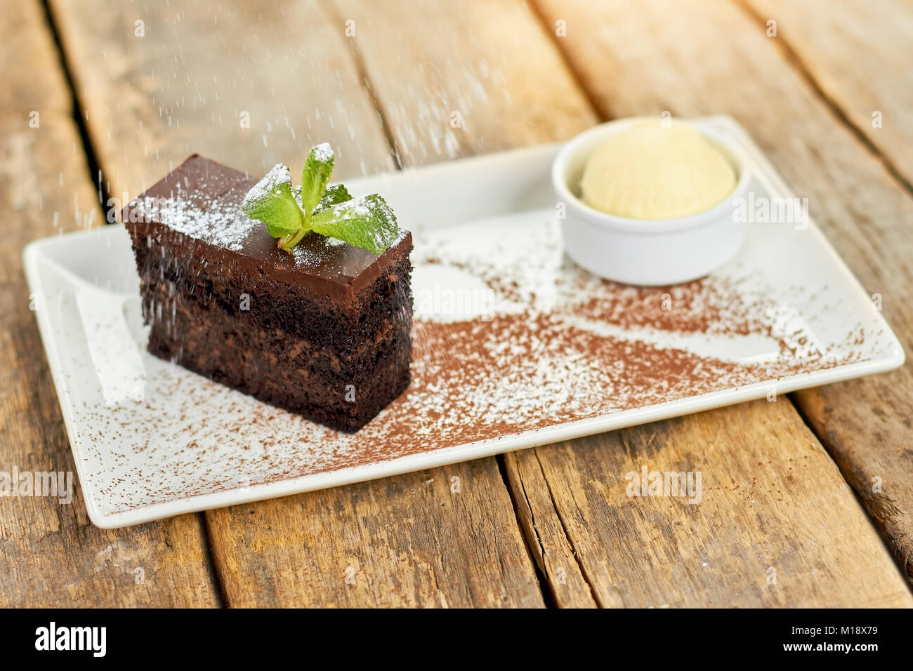 Rain of flour on cake Stock Photo - Alamy