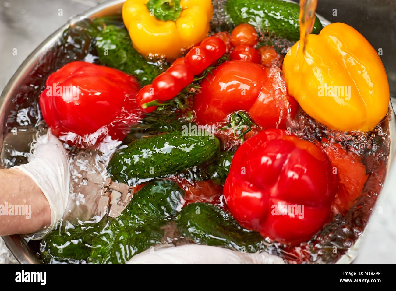 Close up pile of vegetables in a metal bowl full of water Stock Photo ...