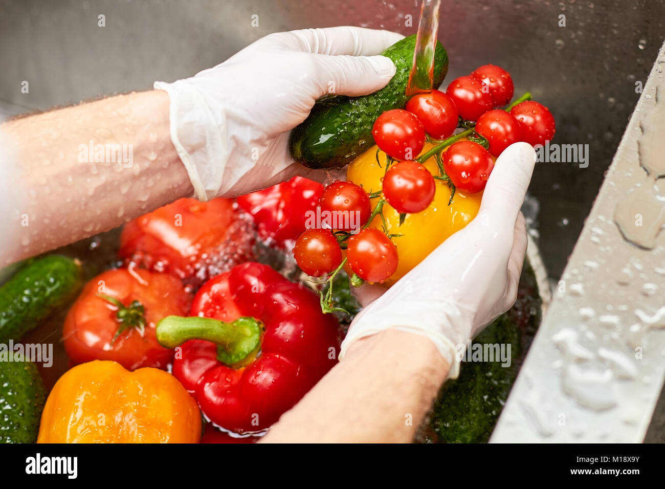 Washing vegetablea in a sink Stock Photo - Alamy