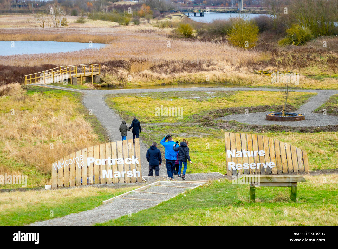 Walkers at the western entrance to Portrack Marsh Nature reserve by ...