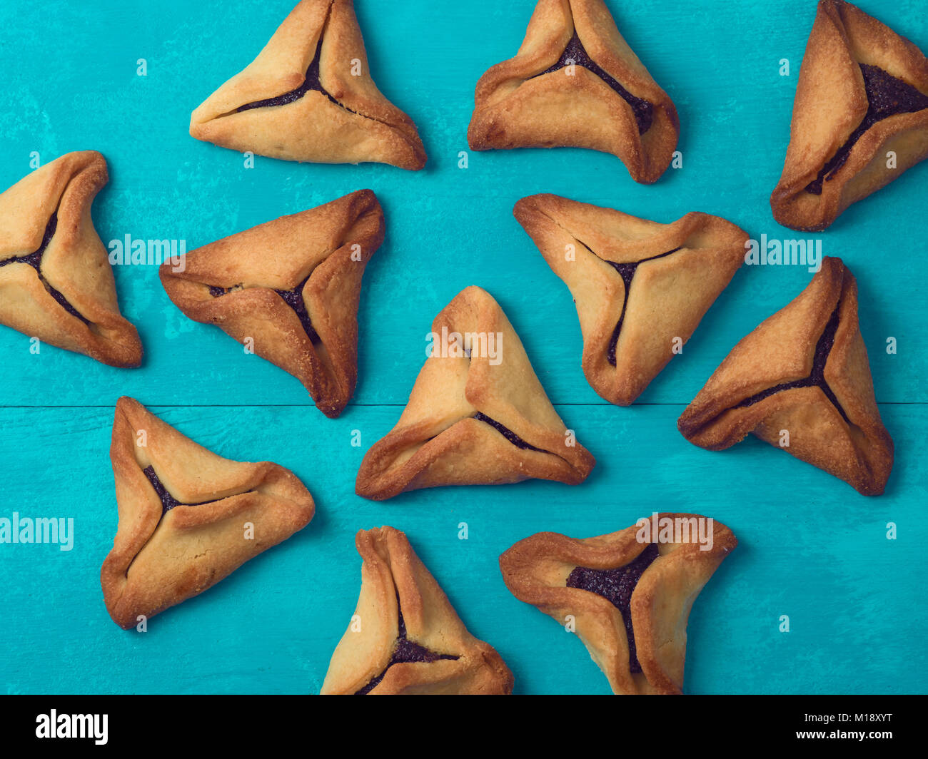Hamantaschen cookies on blue table background. Purim holiday ...