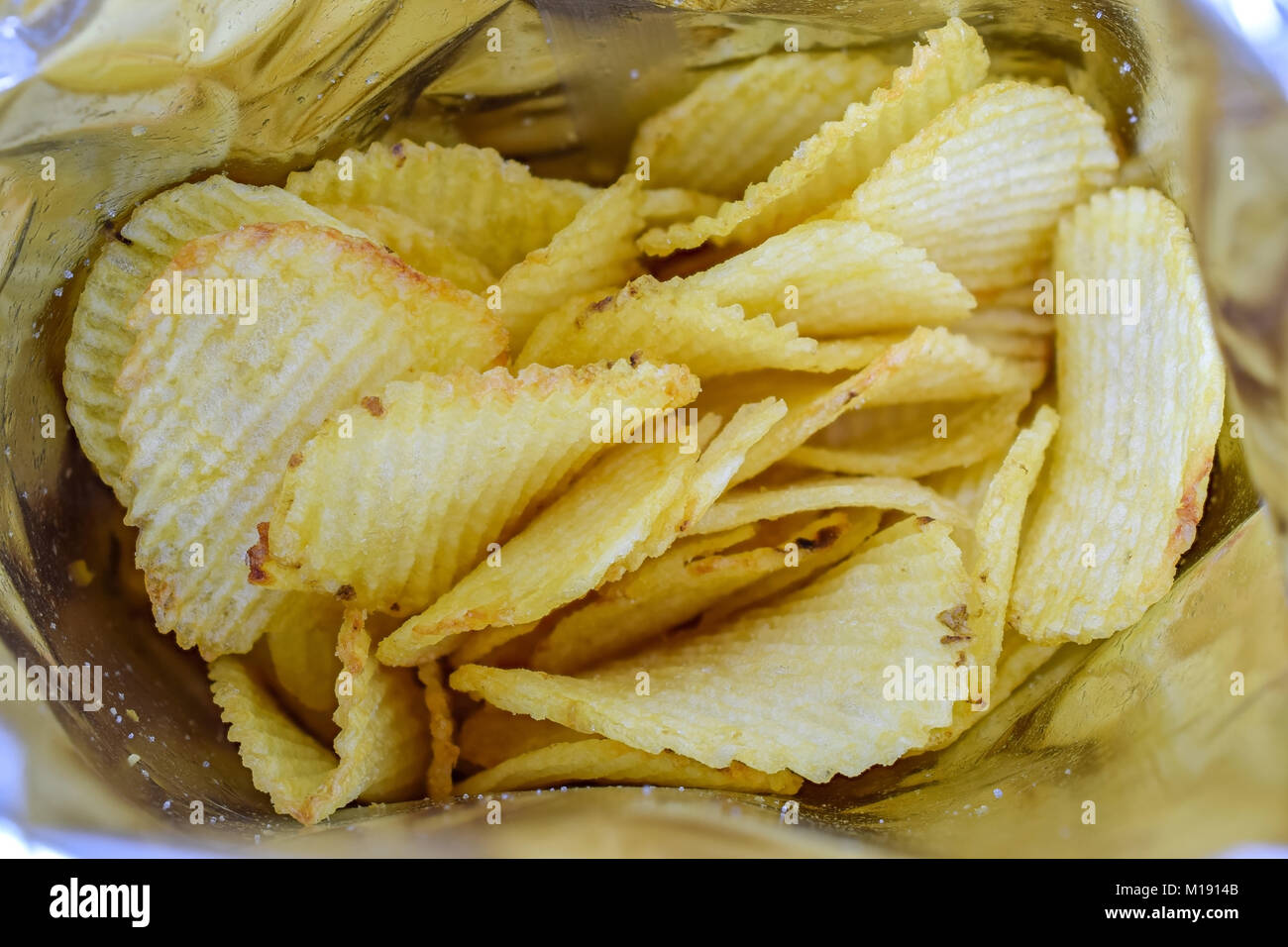 Potato chips is snack in bag ready to eat and fat food or junk food ...