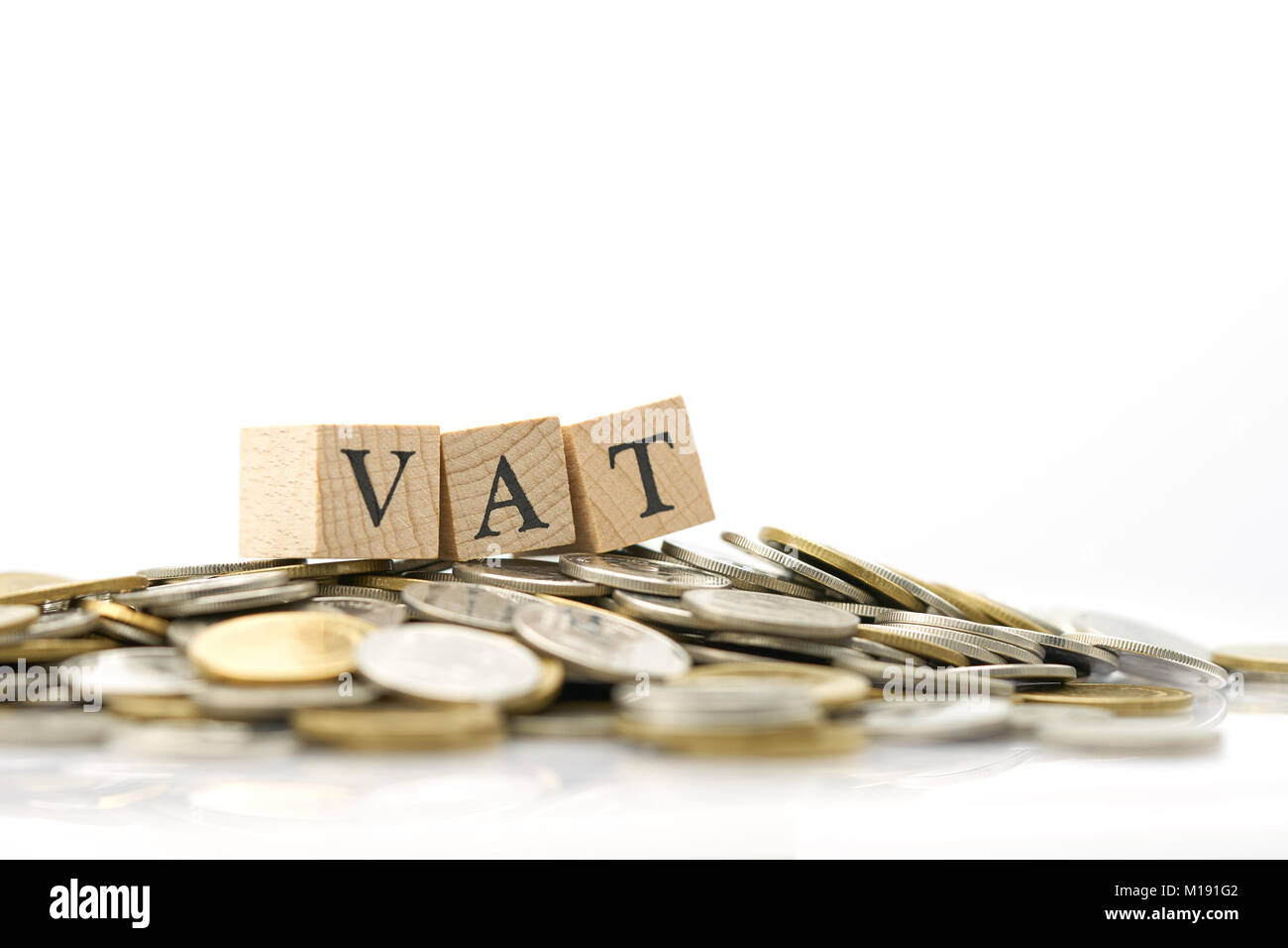 Wood word VAT is placed on a pile of coins.using as background business ...